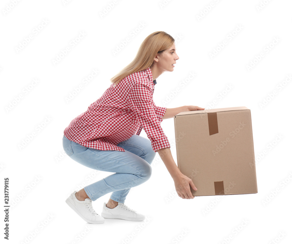 Full length portrait of woman lifting carton box on white background ...