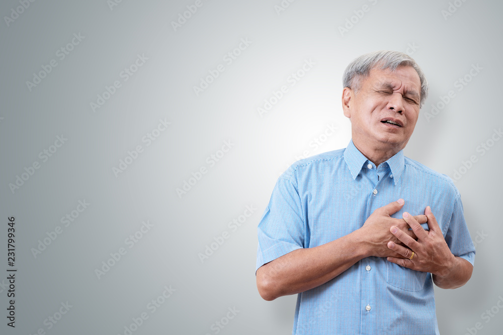 Older asian man clutching and having chest pain cause from heart attack ...