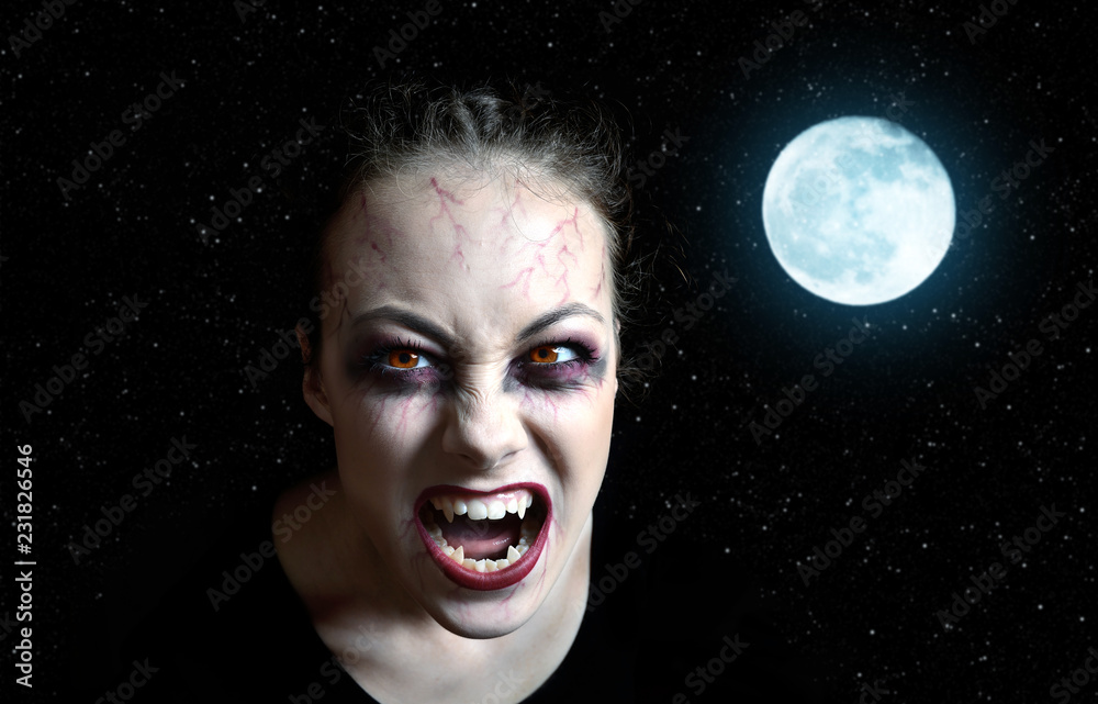 Halloween angry vampire woman in night sky with moon. Horror theme ...