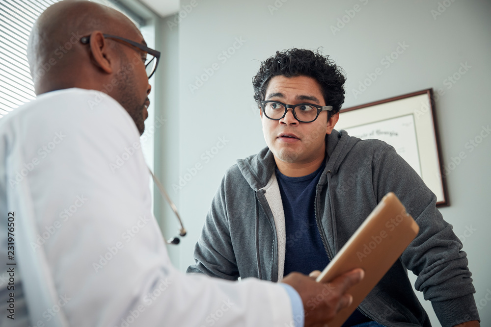 Doctor speaking with patient Stock Photo | Adobe Stock