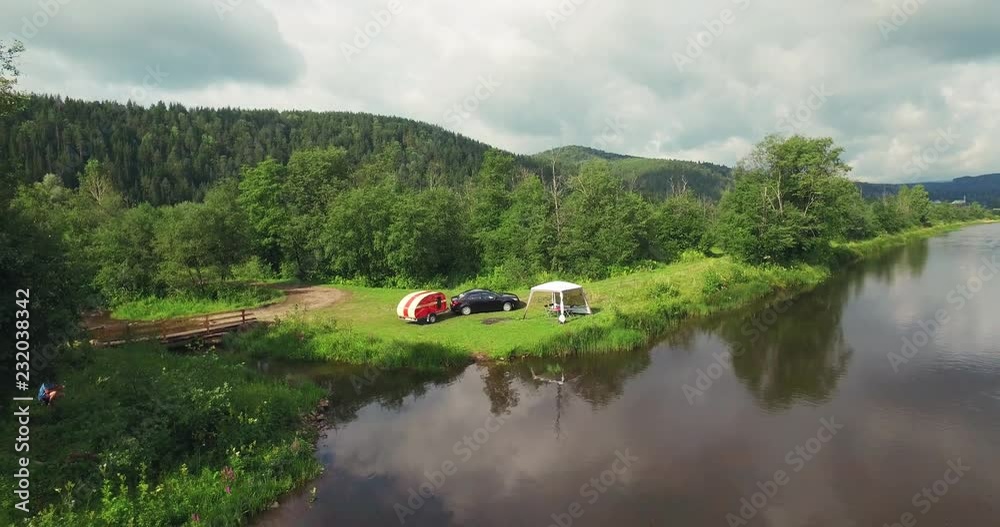 Family Car Camping with Residential Trailer and Tent on the River Coast ...