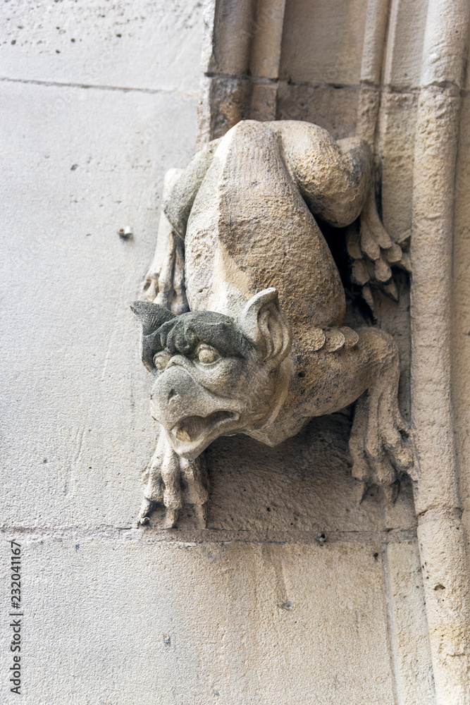 Gargoyles on the wall of a medieval building. Stock Photo | Adobe Stock