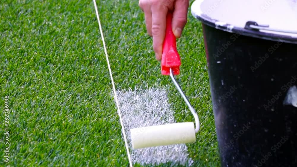 Marking football stadium field with paint Stock Video | Adobe Stock