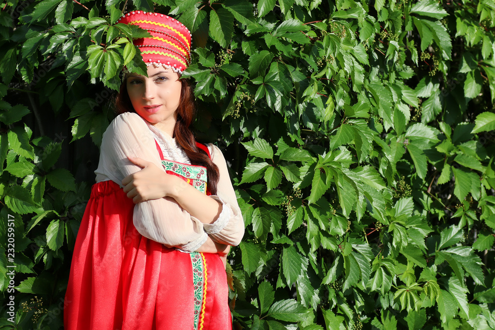 Slav in traditional dress ivy wall tree Stock Photo | Adobe Stock