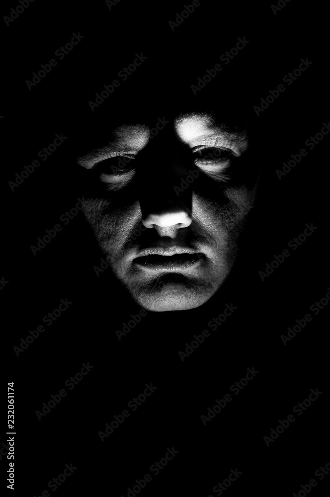 Desaturated man's face illuminated from below with flashlight Stock ...