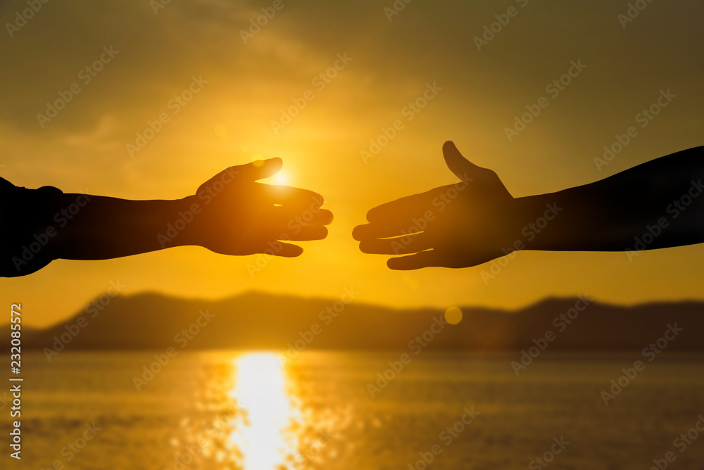 Silhouette of helping hand concept and international day of peace ...