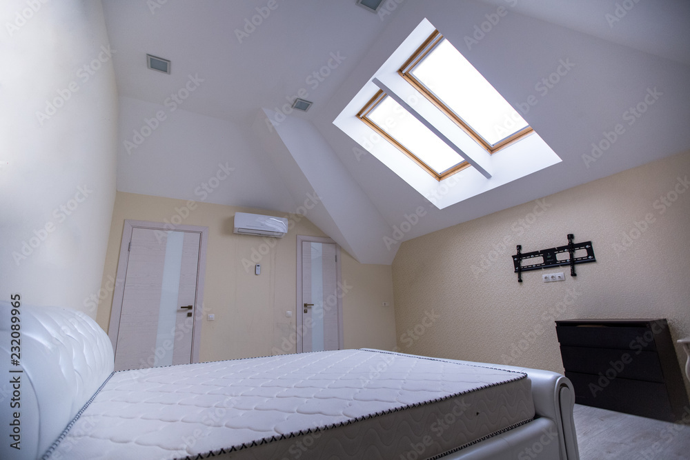 interior of an empty room with a bed Stock Photo | Adobe Stock