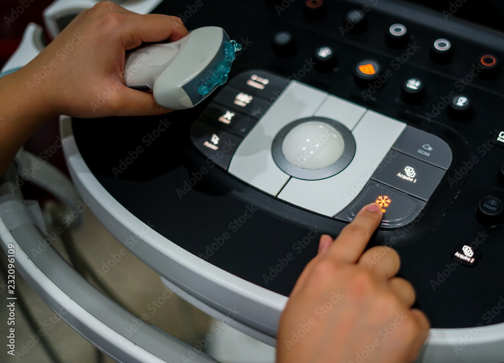 Ultrasonography (USG) hand holding ultrasound probe and coupling gel ...