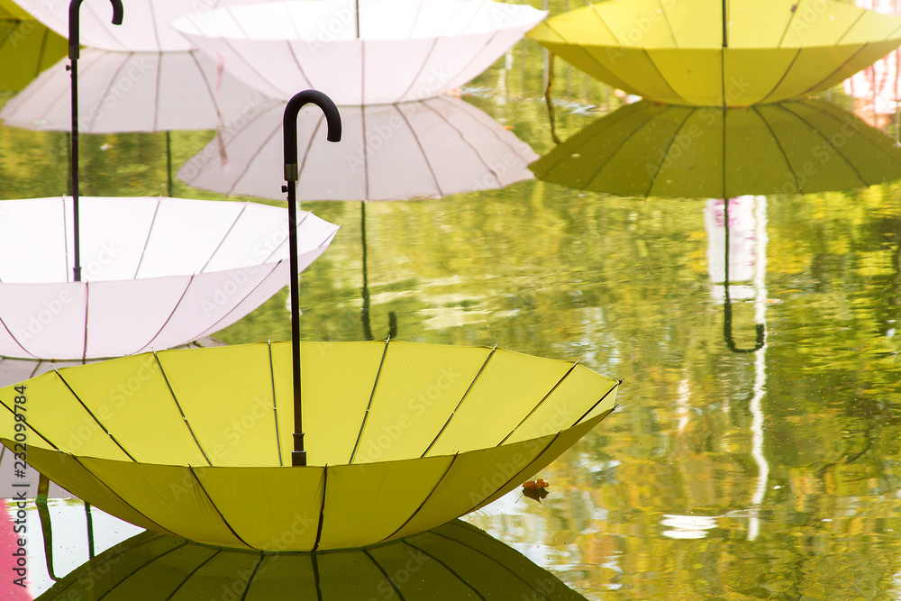 the inverted umbrella is floating on the water Stock Photo | Adobe Stock