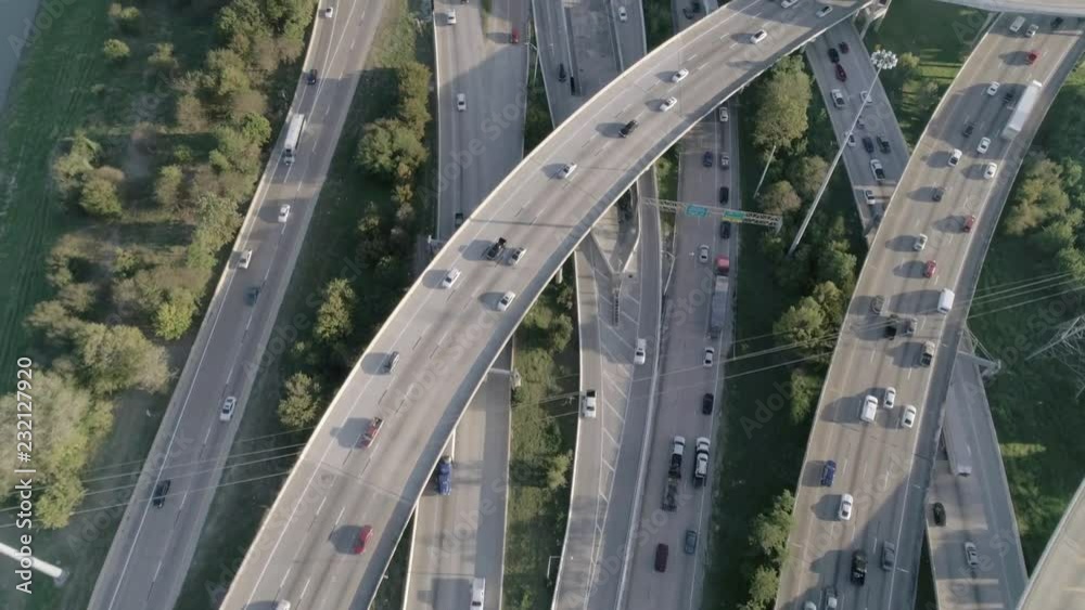 This video is of an aerial of heavy traffic on freeway in major city ...