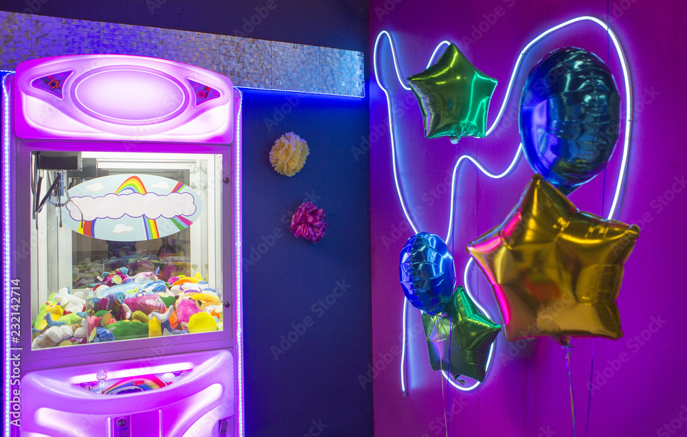 Crane claw machine with balloons Stock Photo | Adobe Stock