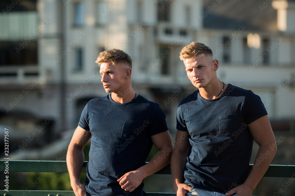 Foto de Muscular and stylish at the same time. Pair of twins with ...