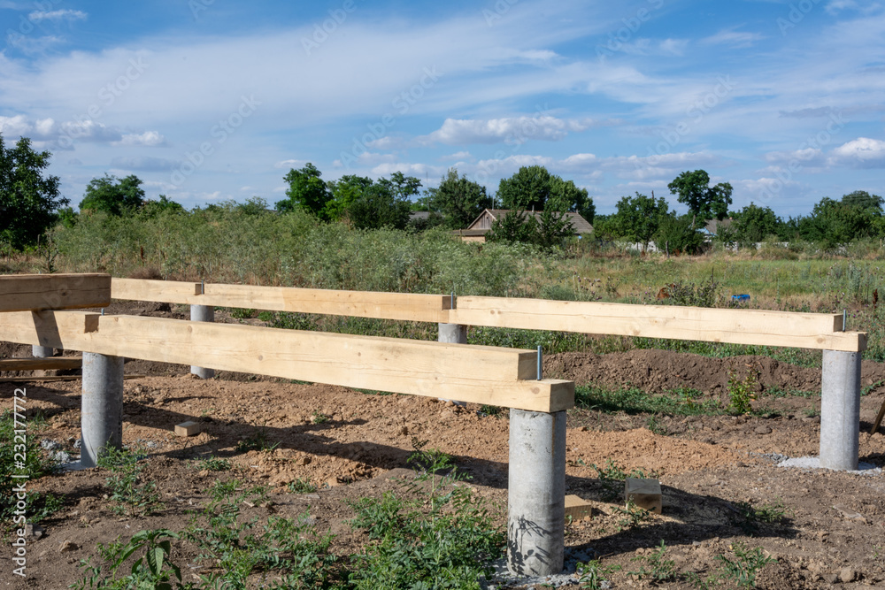 Foundation construction. Unfinished frame house. Building process of ...