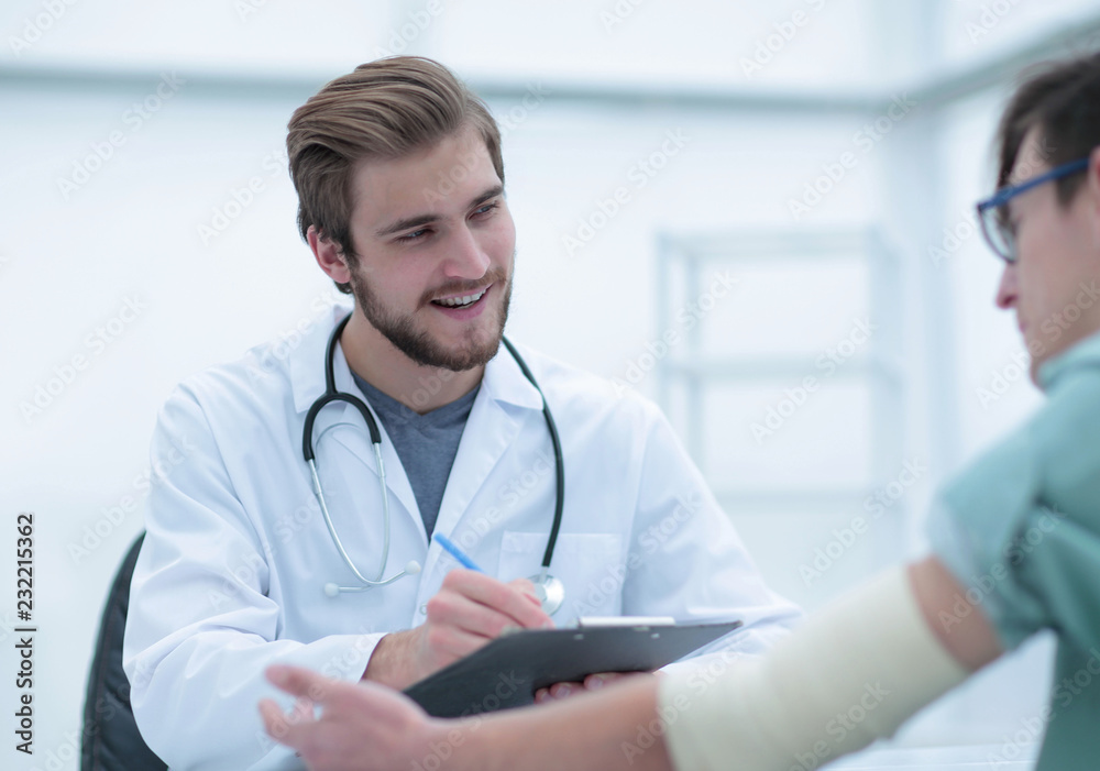 doctor writing a prescription to her patient, Stock Photo | Adobe Stock