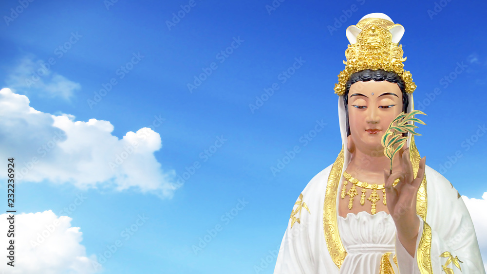 guan yin the goddess of mercy statue with sky background Stock Photo ...