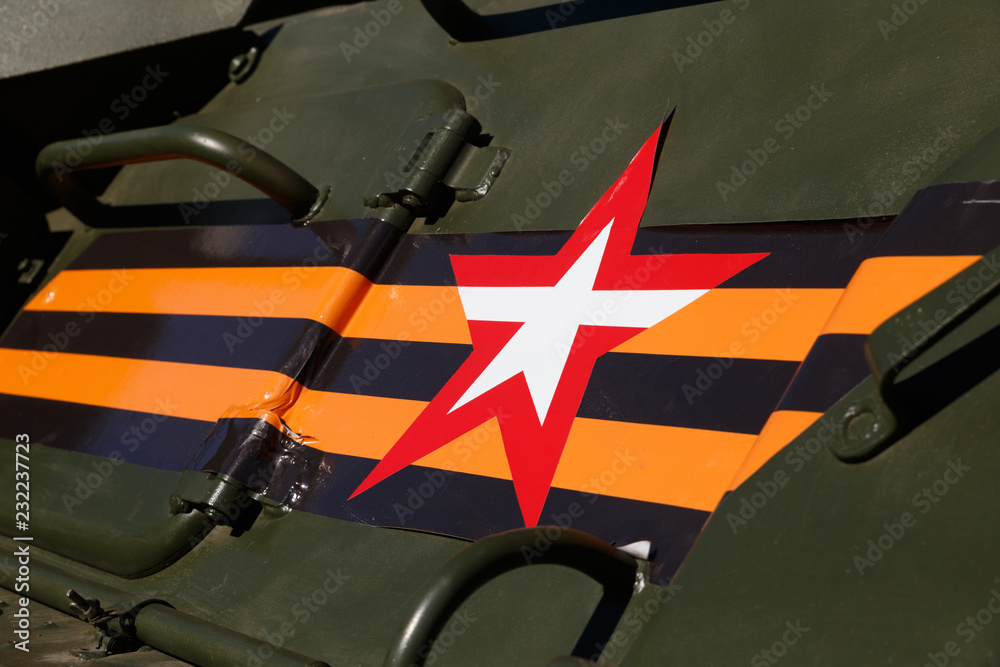 Red Star and St. George ribbon painted on the armor of the tank ...