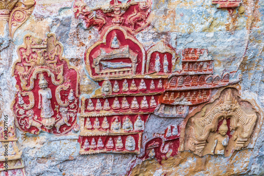Religious carvings on limestone rock in sacred Kaw Goon cave near Hpa ...
