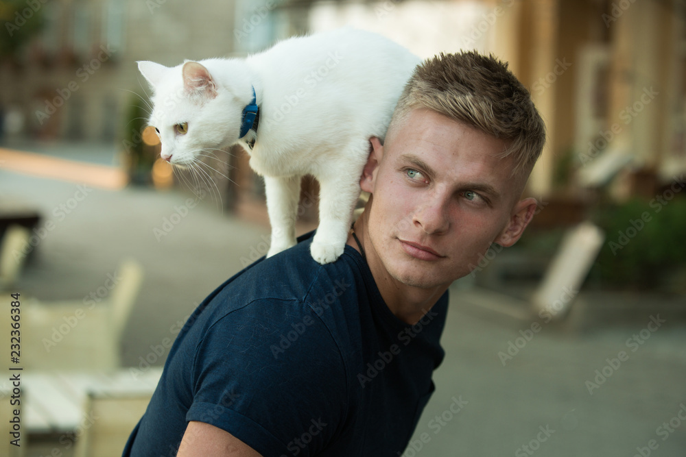 Curious explorer. Happy man on walk with cat pet. Muscular man hold ...