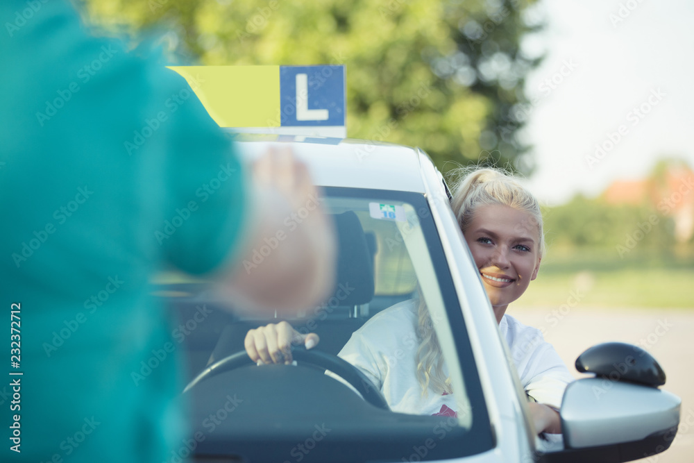 Learner driver girl with instructor learning how to drive car Stock ...