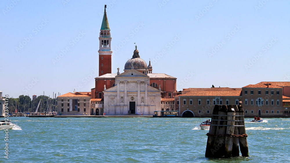 Venice Canal Mooring Post and Cathedral Stock Photo | Adobe Stock