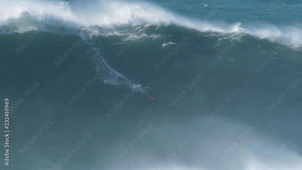 Big wave surfer Carlos Burle riding a monster wave in Nazar√©, Portugal ...