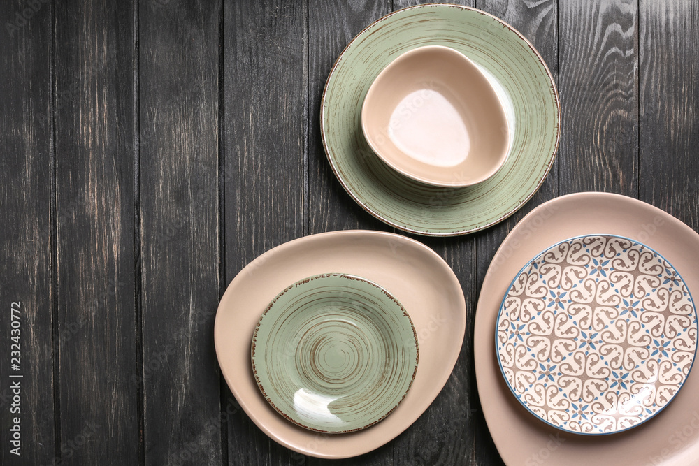 Set of clean color plates on table Stock Photo | Adobe Stock
