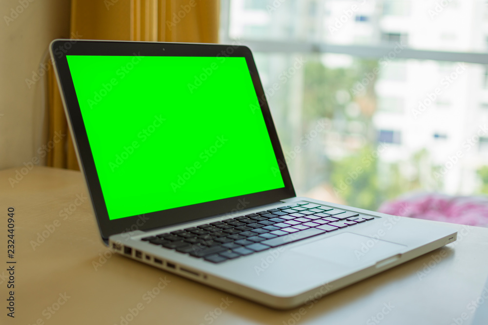 Laptop with green screen for replacement with blur background Stock ...