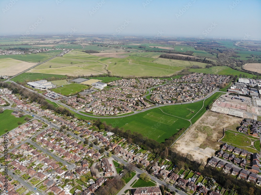 Typical UK Town aerial photo showing rows of houses, roads, parks and ...