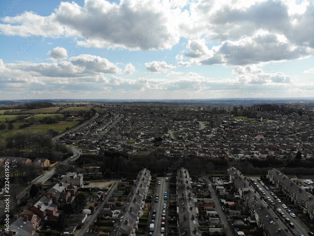 Typical UK Town aerial photo showing rows of houses, roads, parks and ...