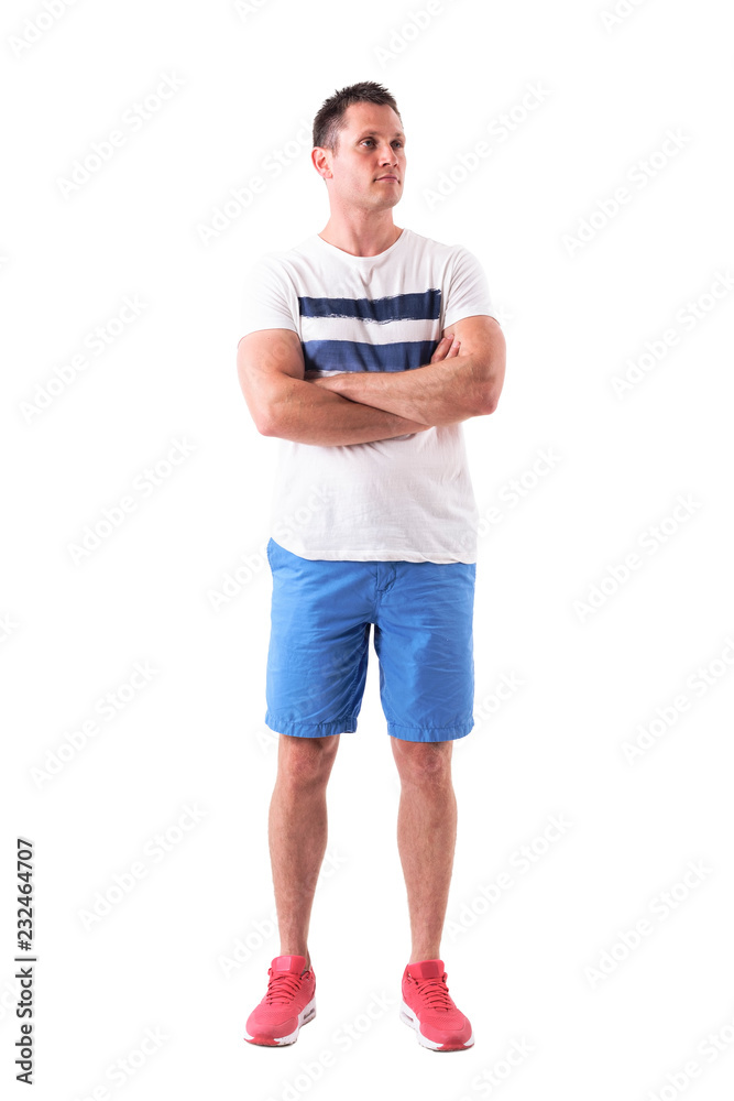 Confident handsome young adult muscular man looking up posing with ...