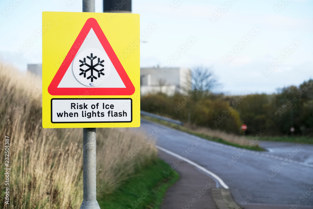 Risk of ice when light flashes winter road safety sign Stock Photo ...