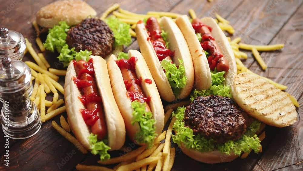 Hot dogs, hamburgers and french fries. Composition of fast food snacks ...