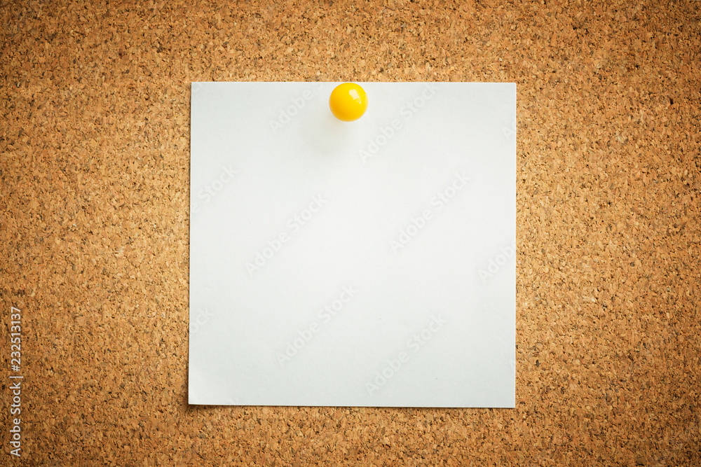 yellow pin white paper on cork board texture or background for note ...