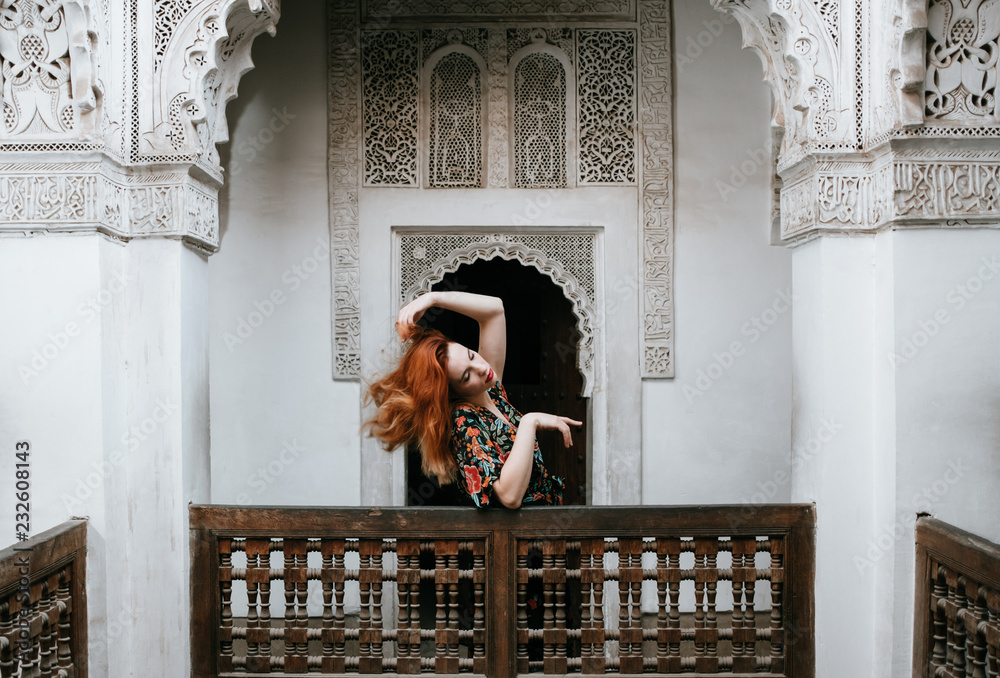 ginger woman posing in a beautiful arabic mosque Stock-Foto | Adobe Stock