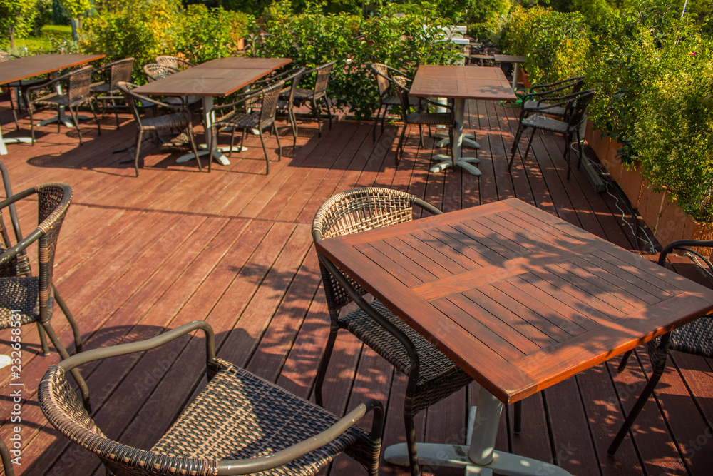 exterior design outdoor patio cafe space with wooden furniture chairs ...