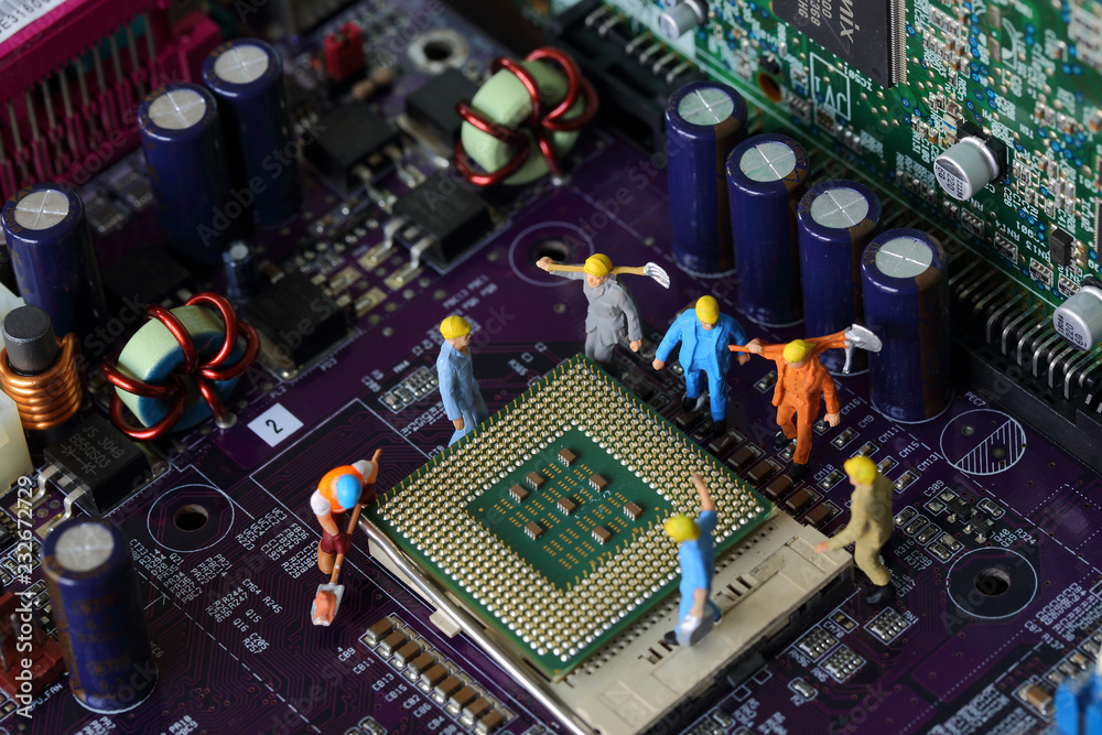 Selective focus of miniature engineer worker to fixed Control ...