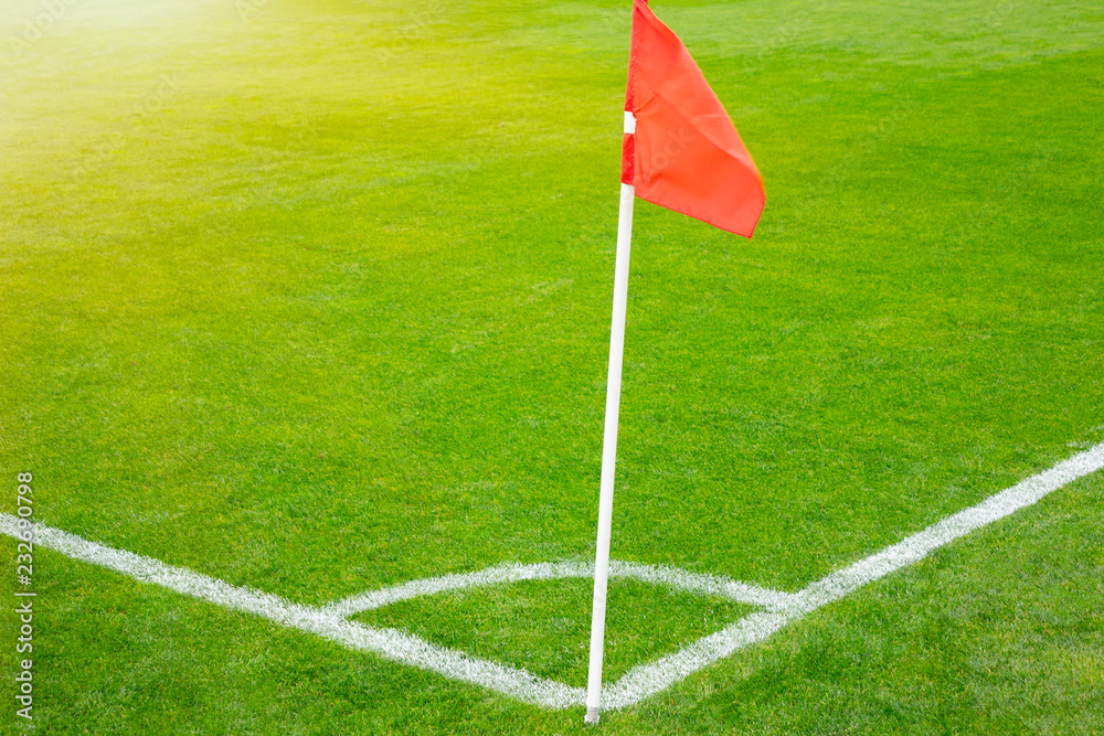 Red flag blow on the pole at corner of football field Stock Photo ...