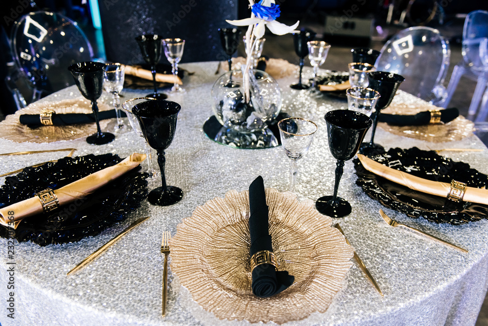 Tables set for an event party or wedding reception. luxury elegant table setting dinner in a ...