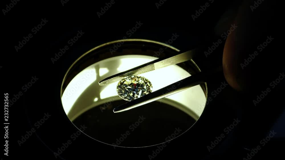 A diamond is examined under the microscope Stock ビデオ | Adobe Stock