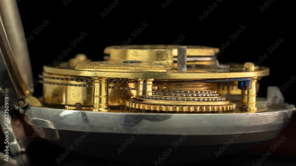 Working mechanism of a vintage watch close up . Black background. Time ...