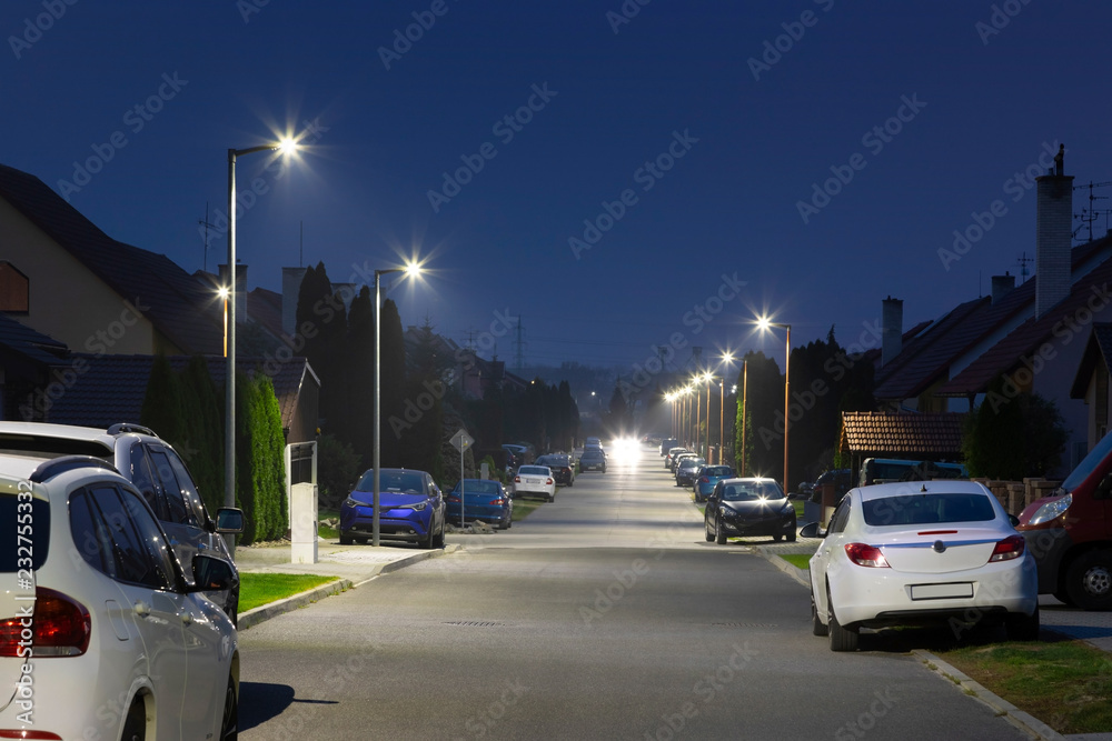 small city street with modern LED streetlights at night Stock Photo ...