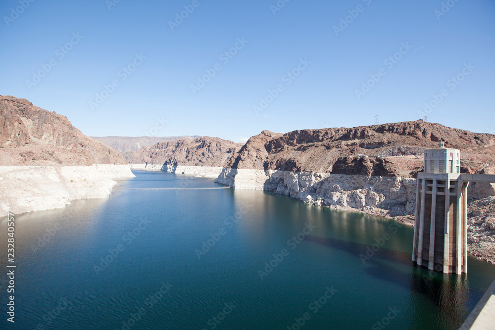 View of Lake Mead behind Hoover Dam and the water towers. The cliffs ...