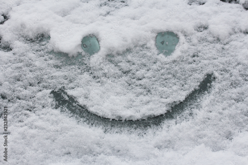 Smiley face on snow surface. Winter concept. Stock Photo | Adobe Stock