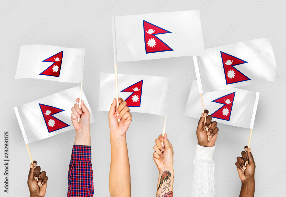 Hands waving flags of Nepal Stock Photo | Adobe Stock