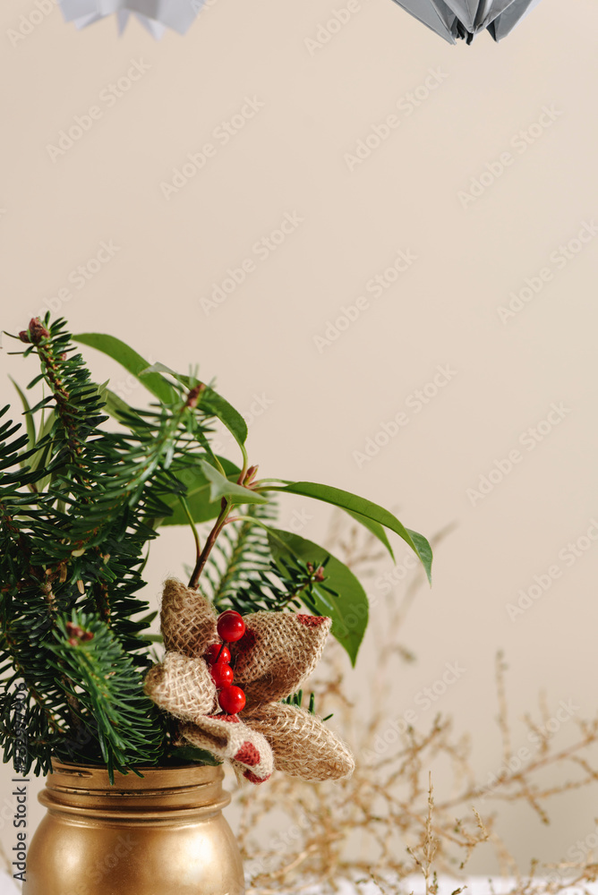 Christmas Tree in gold vase with Pine Branches Bouquet Stock Photo ...