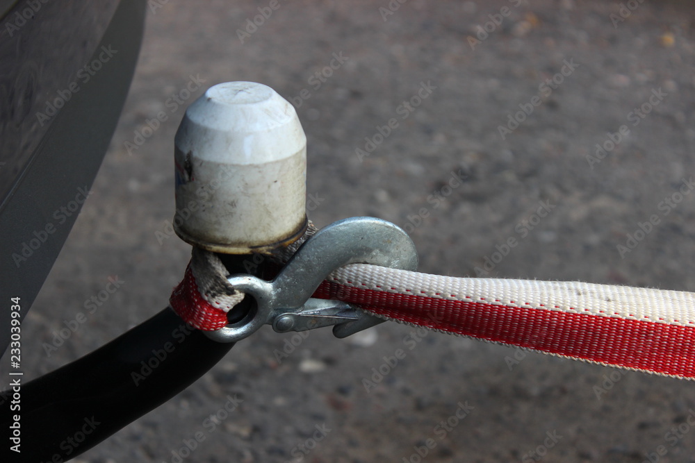 Technical assistance, car towing - tow rope with hook tied to the ...