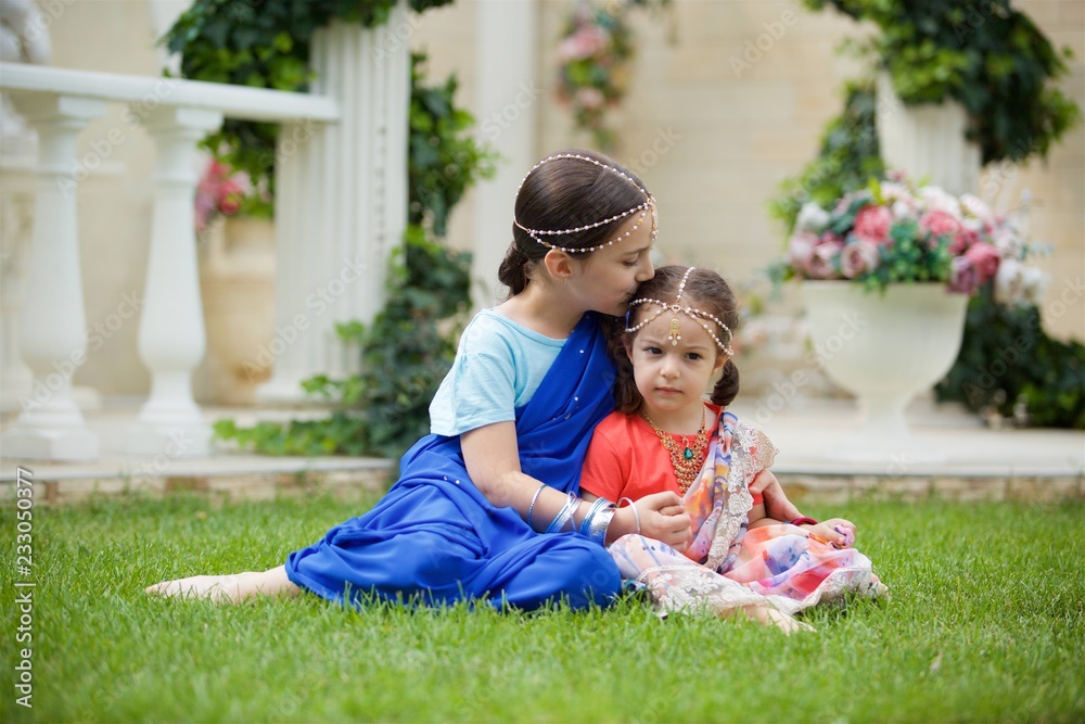 Little girls child dressed in a Sari of Indian culture. Stock Photo ...