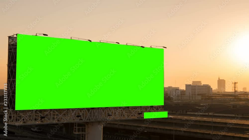 Green screen of advertising billboard on expressway during the sunset ...