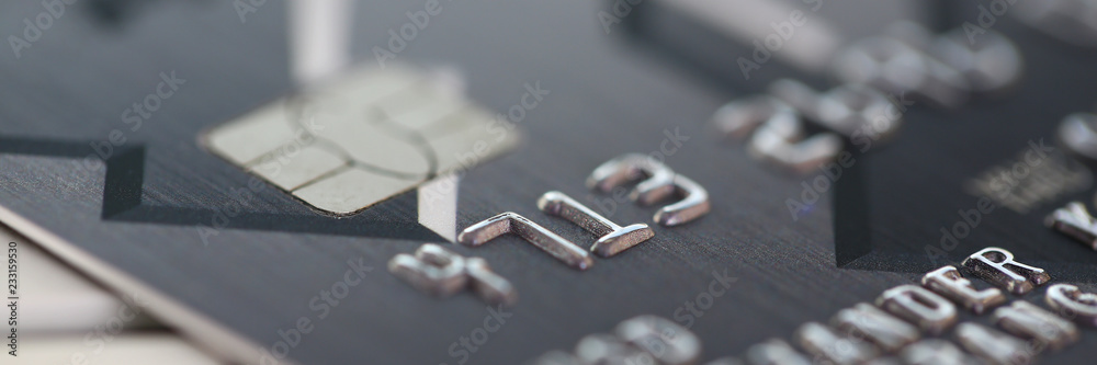 Embossed chipped credit card lying on silver keyboard Stock Photo ...