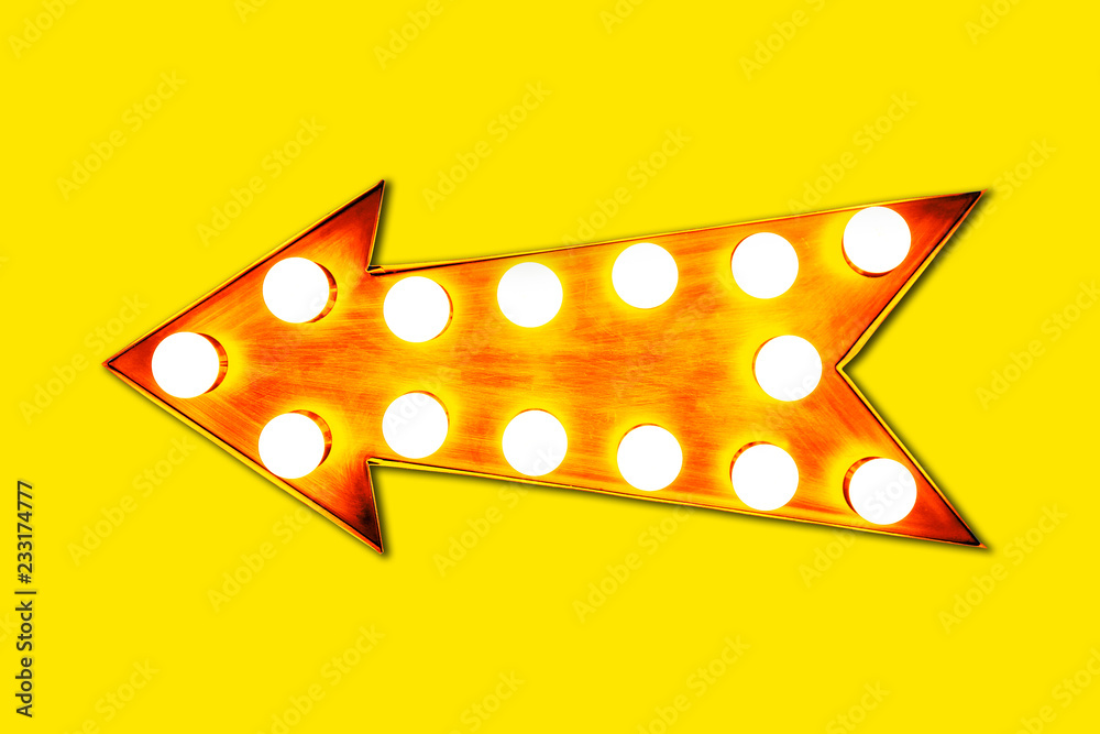 Orange, yellow and red illuminated metallic display golden arrow sign ...